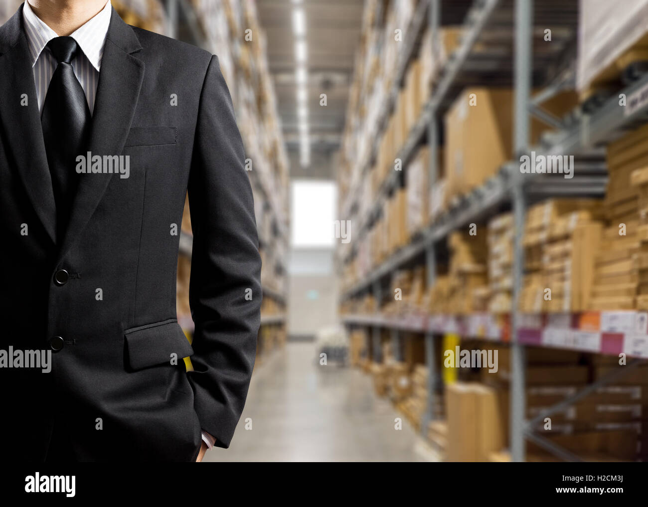 Businessmen In Warehouse preparing goods for dispatch Stock Photo - Alamy