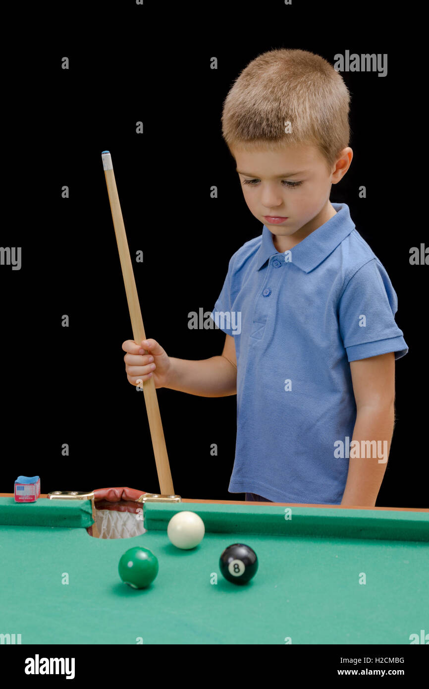 Beautiful boy playing billiard (pool Stock Photo - Alamy