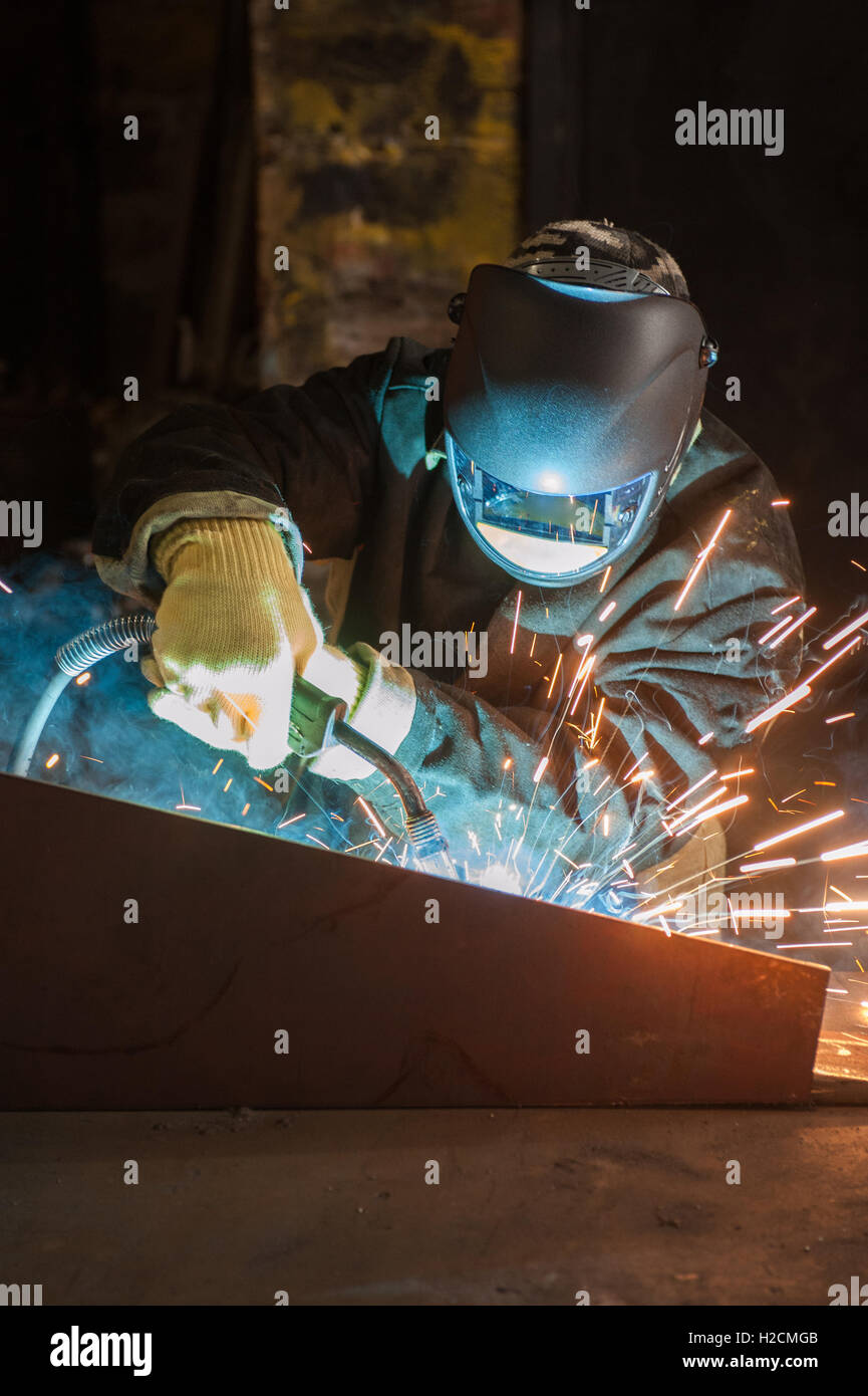 worker welding metal Stock Photo - Alamy