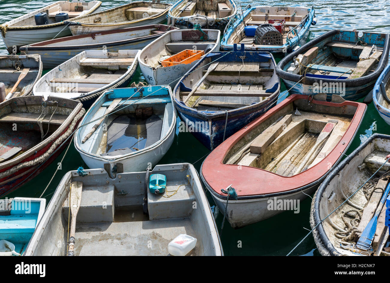 Colorful rowing boats tied up together hi-res stock photography and ...