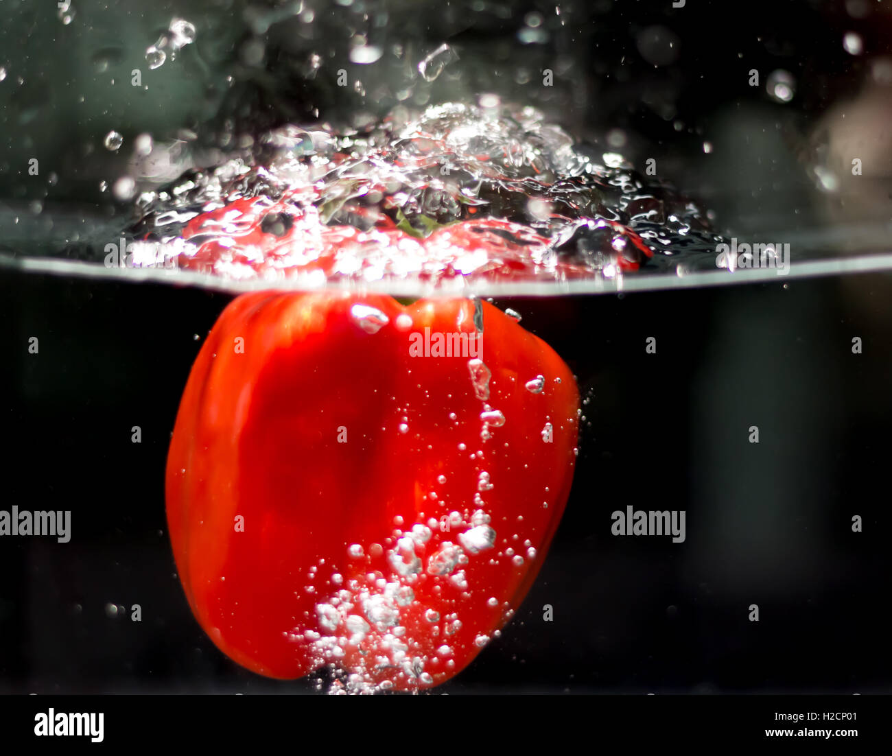 bell pepper drop in the water Stock Photo - Alamy