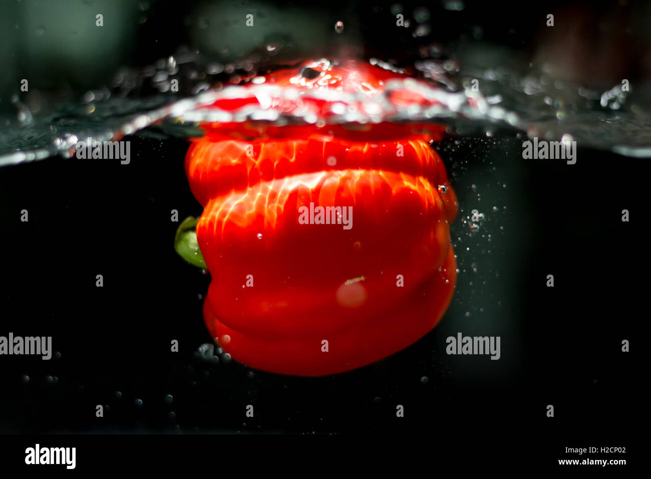bell pepper drop in the water Stock Photo - Alamy