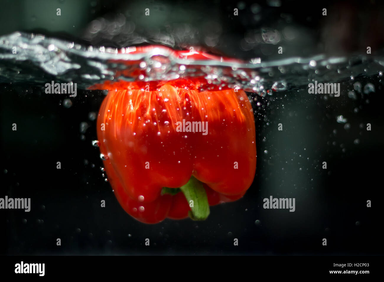 bell pepper drop in the water Stock Photo - Alamy