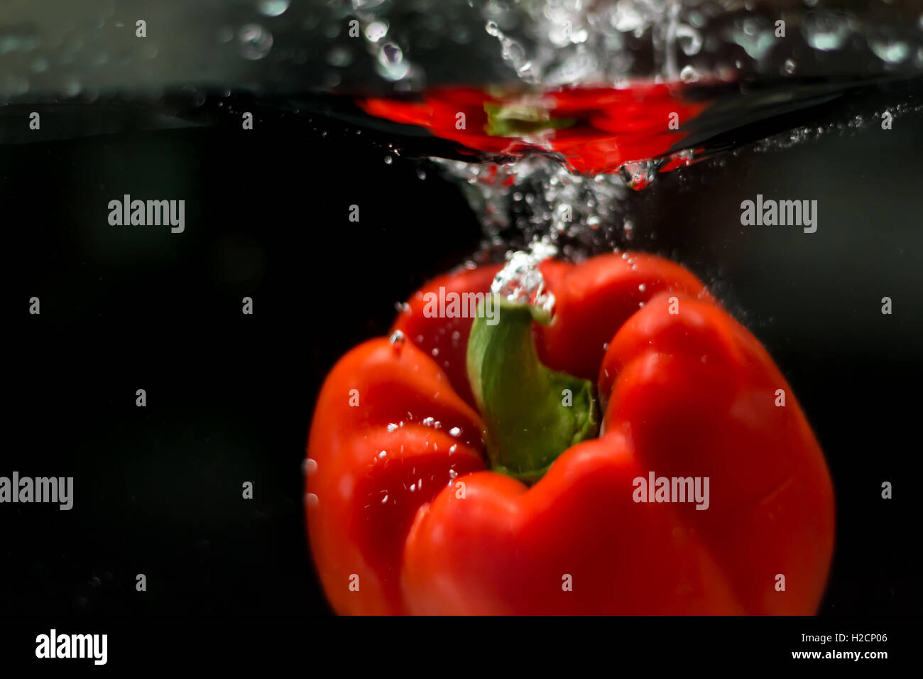 bell pepper drop in the water Stock Photo - Alamy
