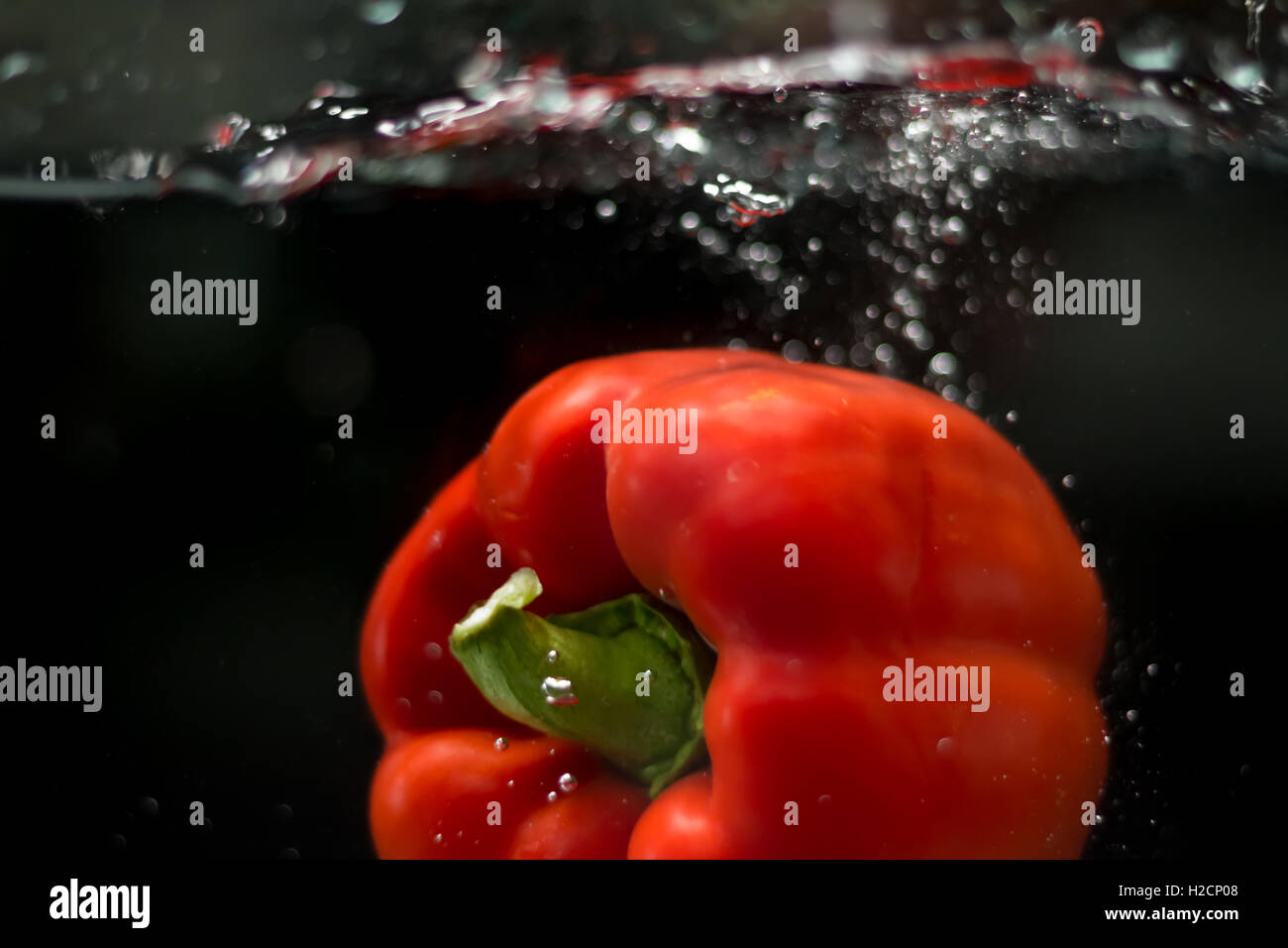 bell pepper drop in the water Stock Photo - Alamy