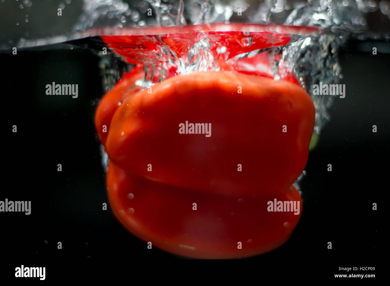 bell pepper drop in the water Stock Photo - Alamy