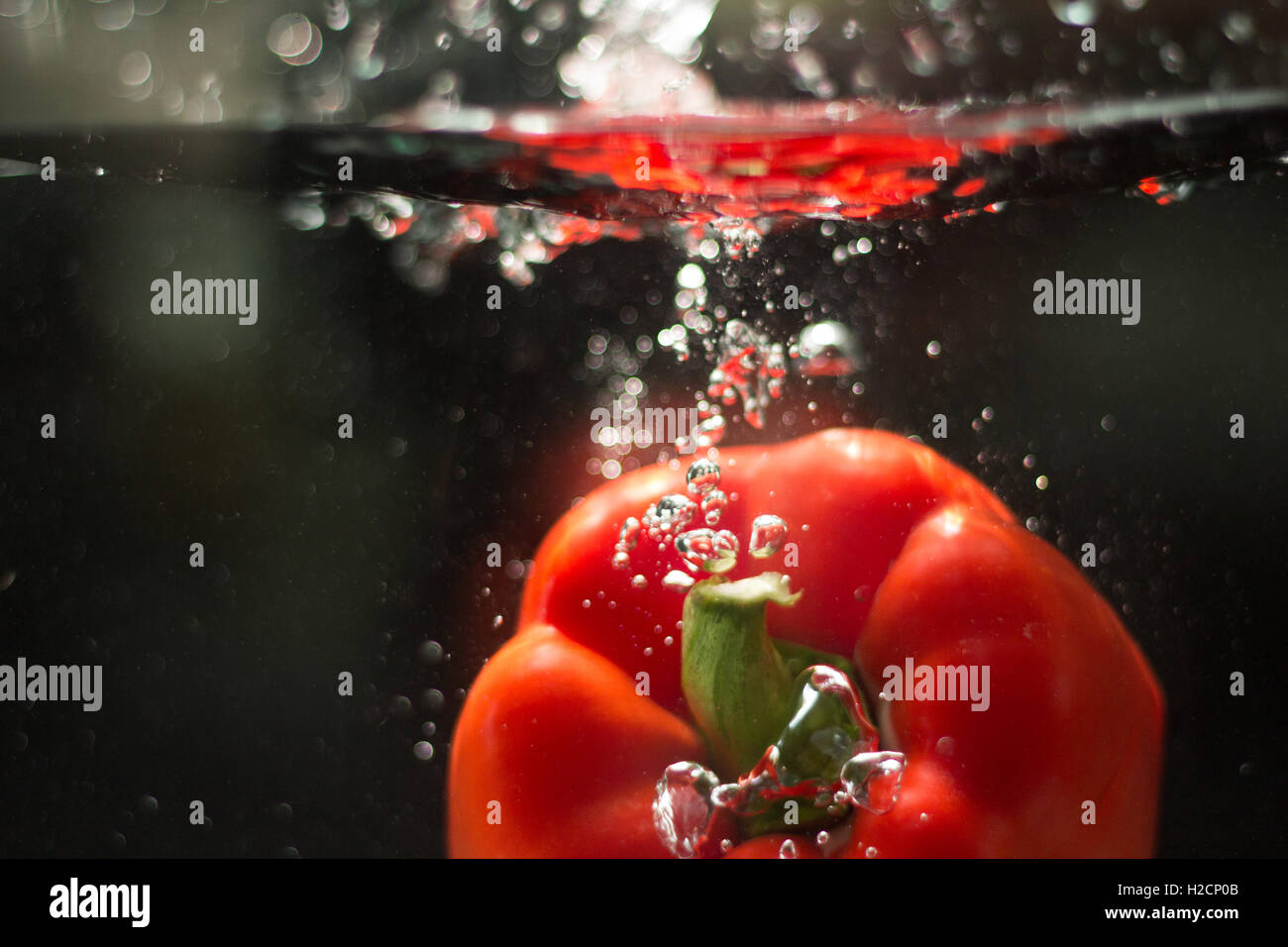 bell pepper drop in the water Stock Photo - Alamy
