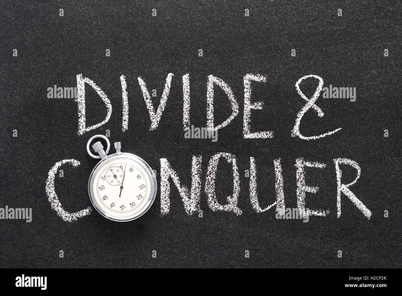 divide and conquer phrase handwritten on chalkboard with vintage ...