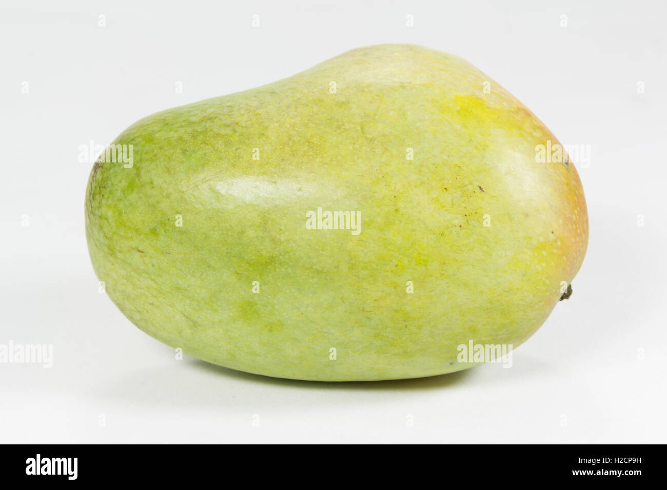 Green mango isolated on white background Stock Photo - Alamy