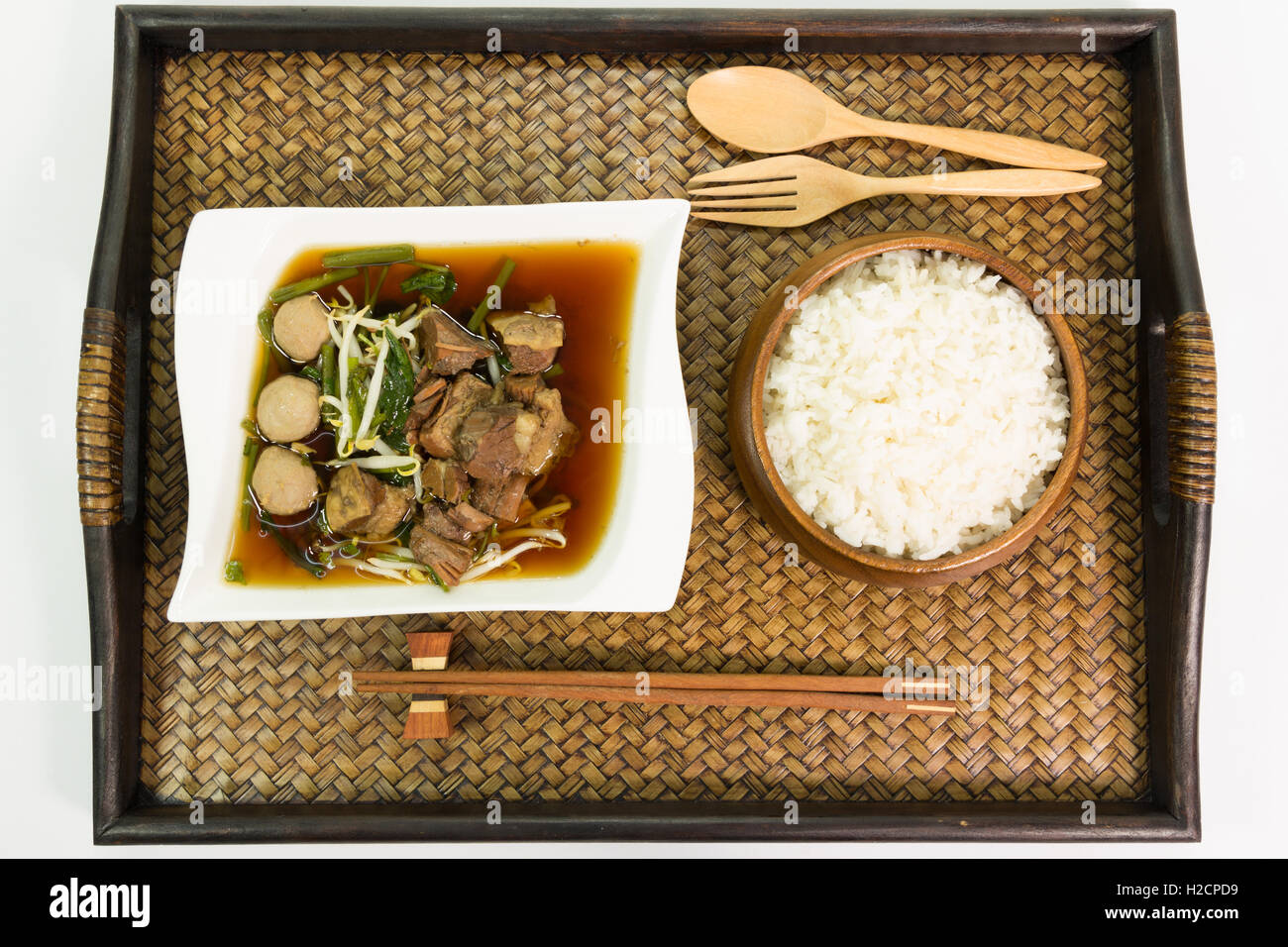Stewed beef soup with rice on wood tray Stock Photo - Alamy