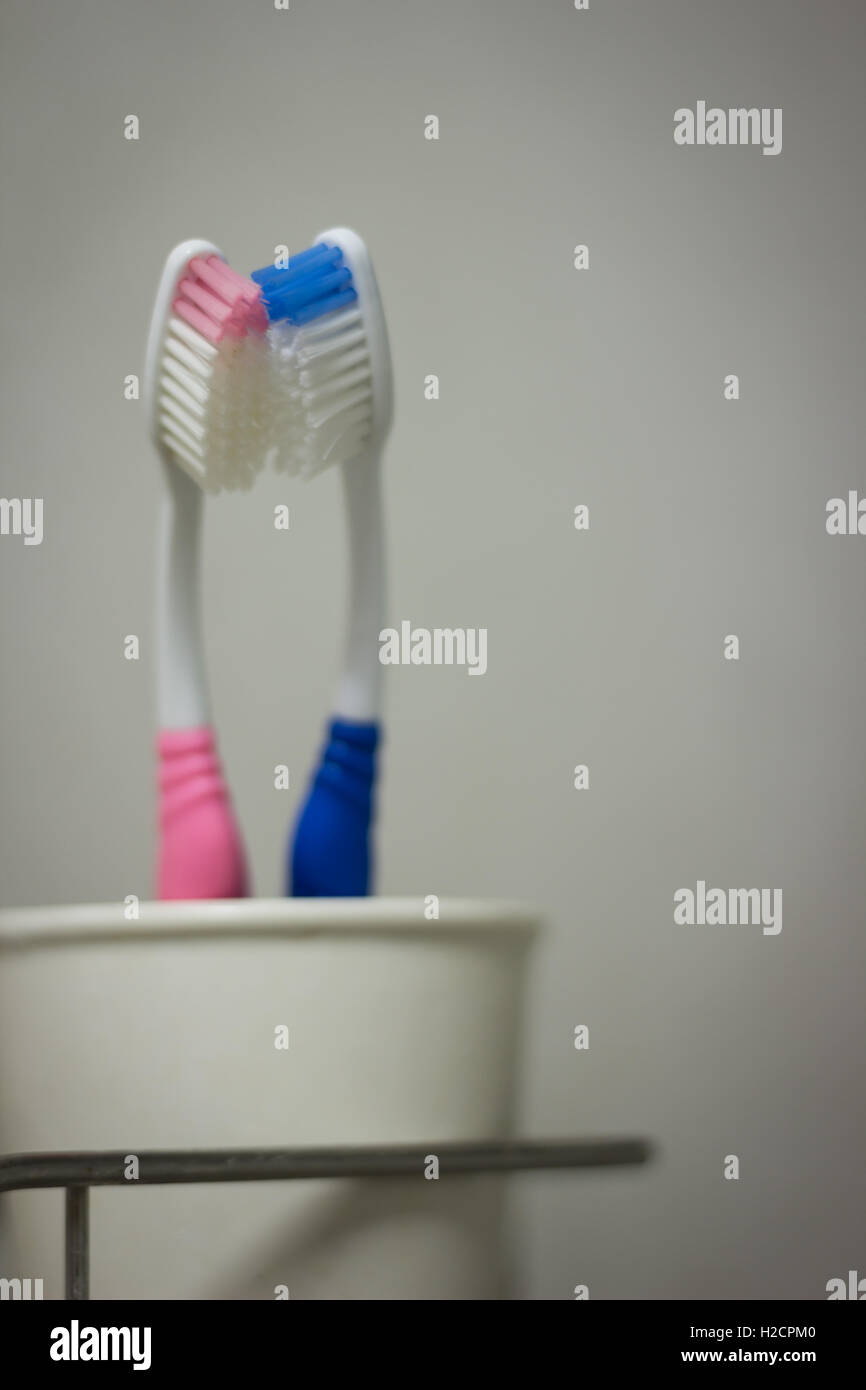 two toothbrush in ceramic glass Stock Photo - Alamy