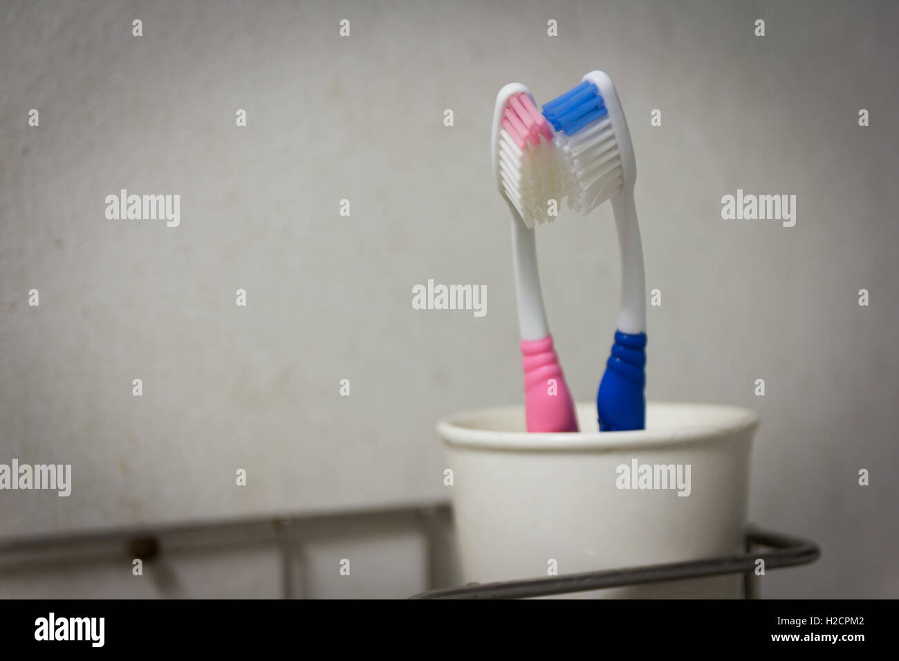 two toothbrush in ceramic glass Stock Photo - Alamy
