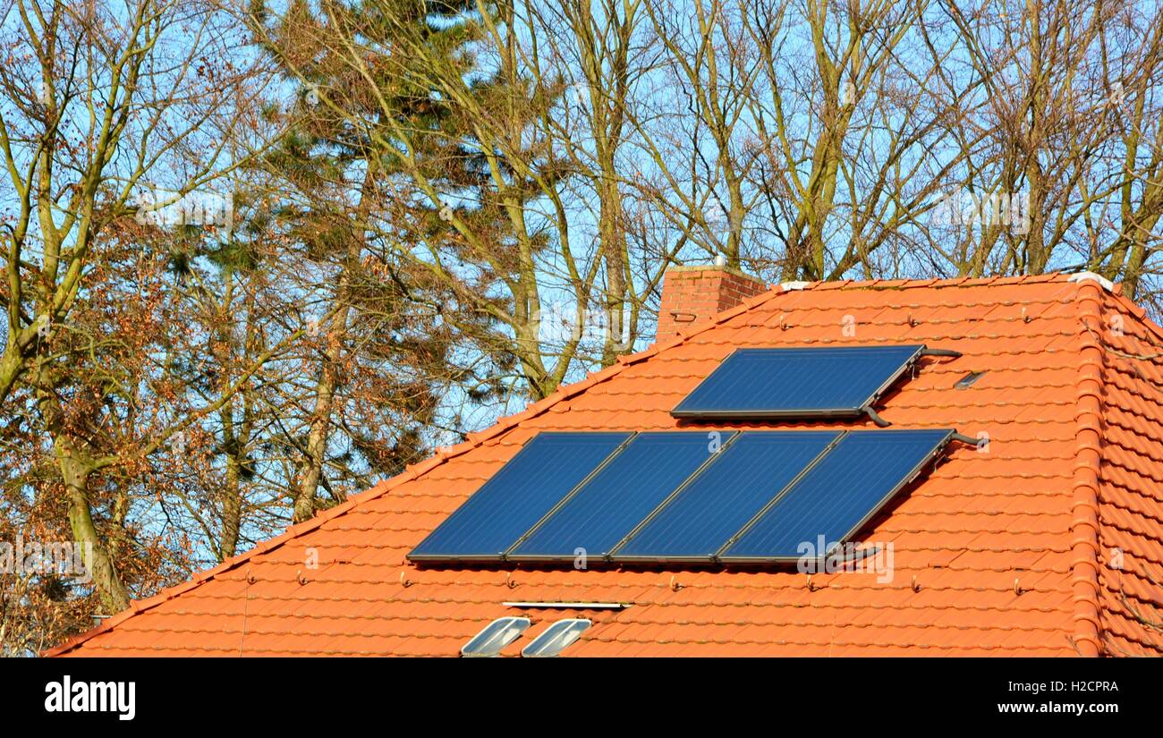 Ecological and renewable solar energy panels on the roof of a house ...