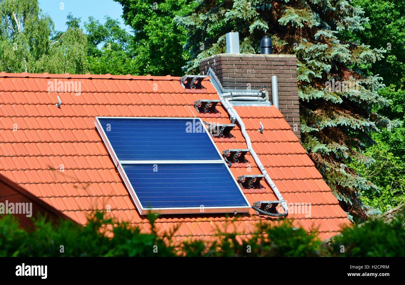 Ecological and renewable solar energy panels on the roof of a house ...