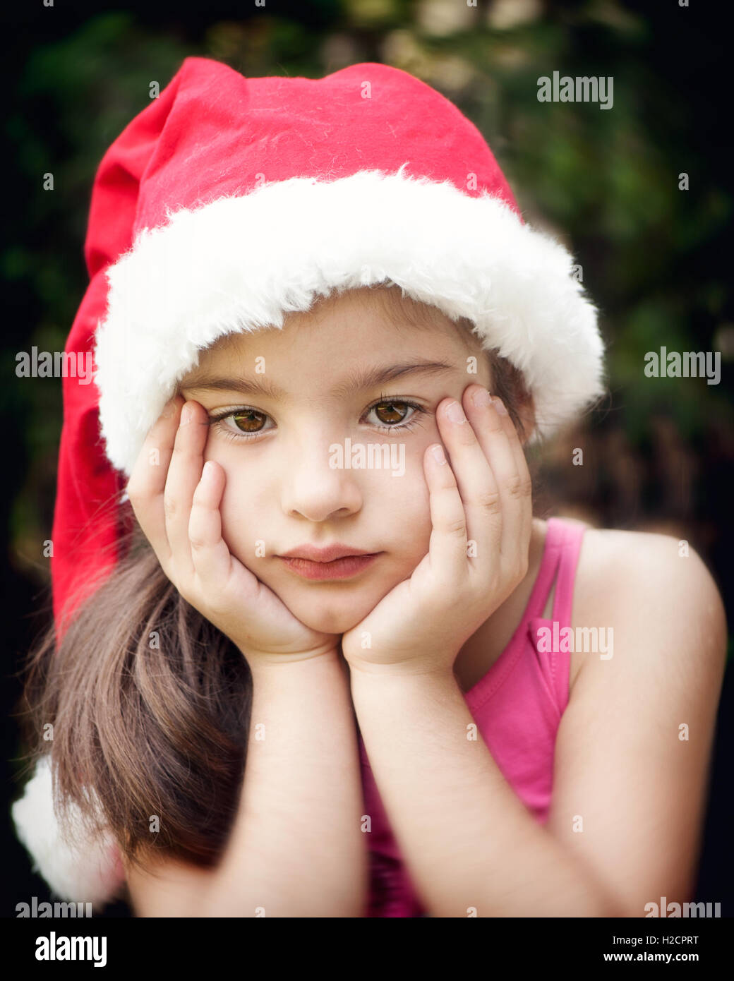 Little girl wearing Santa Claus hat Stock Photo - Alamy
