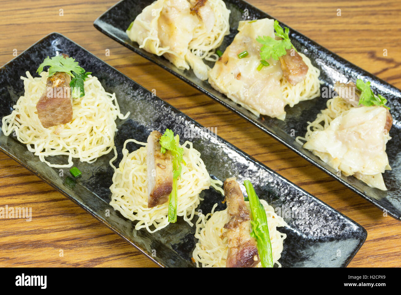 Noodle pork grill with dumpling Stock Photo - Alamy