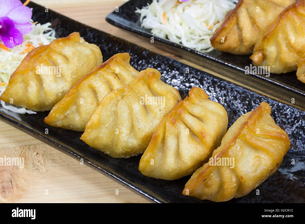Chinese fried dumpling on plate Stock Photo - Alamy