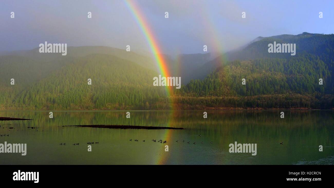A rainbow over the Hood River near Bennett Pass at Mount Hood National ...