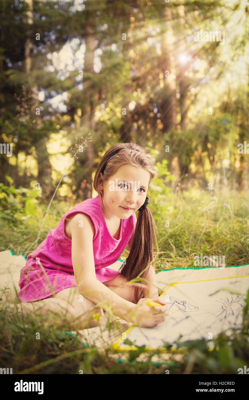 little girl drawing outdoors nature rest forest Stock Photo - Alamy