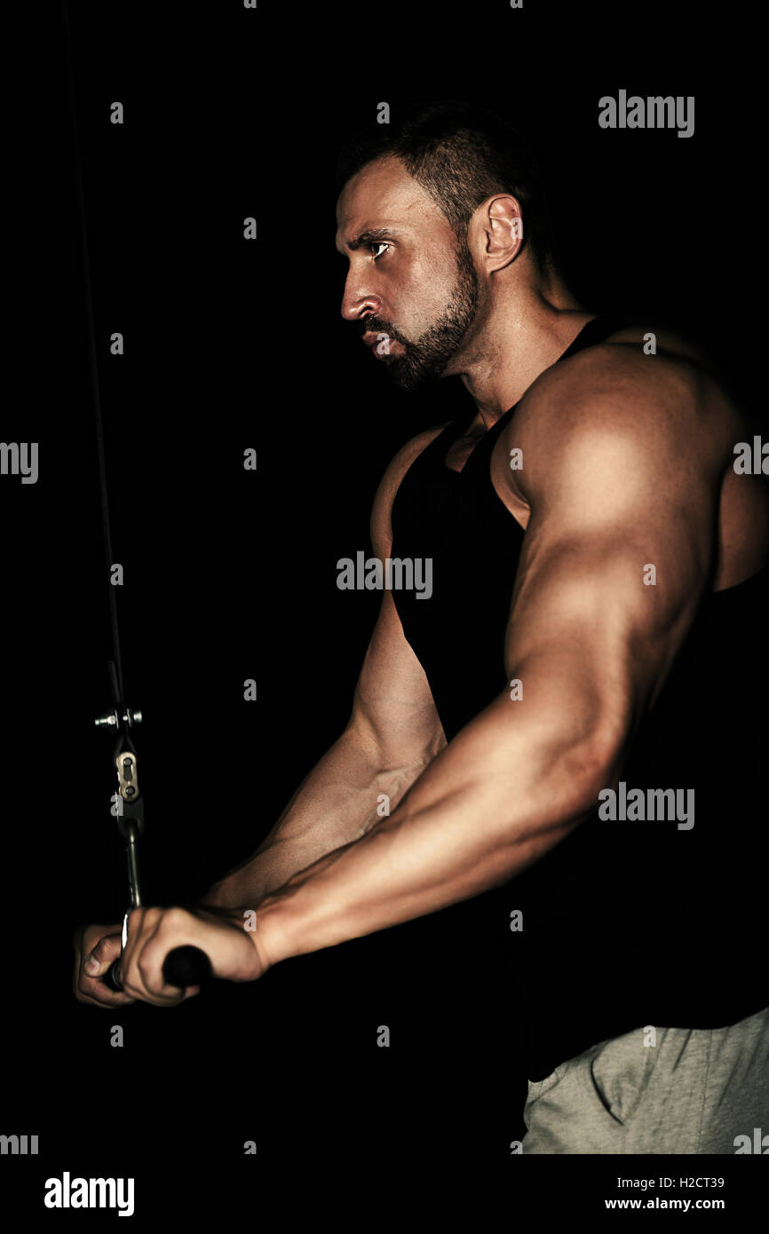 Training bodybuilder strong man arm workout gum Stock Photo - Alamy