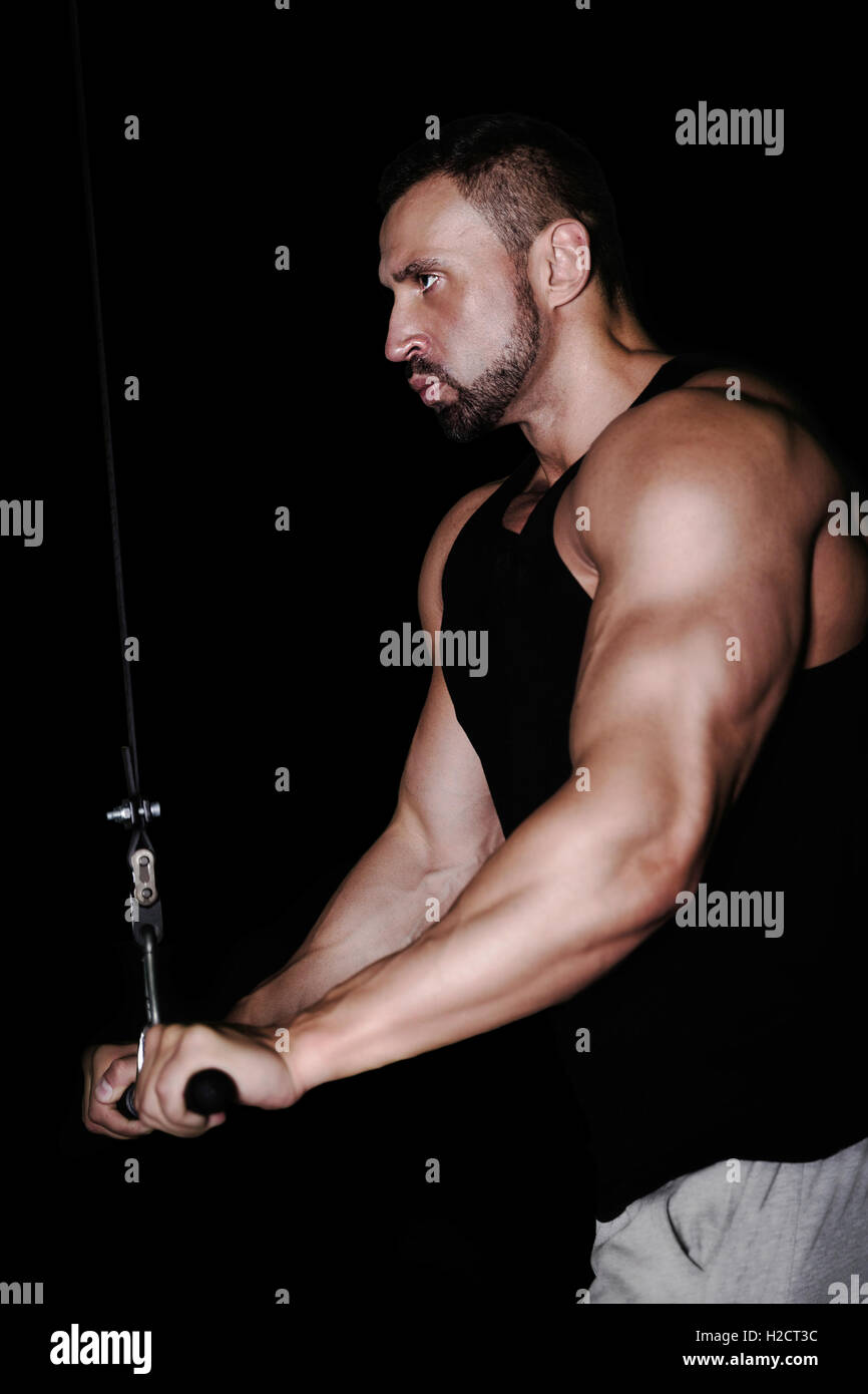 Training bodybuilder strong man arm workout gum Stock Photo - Alamy