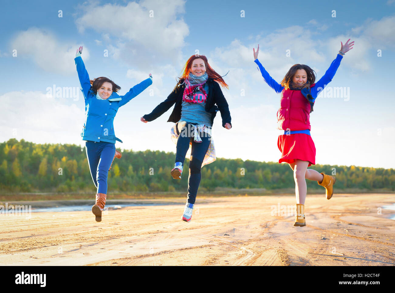 Women have fun near lake Stock Photo - Alamy