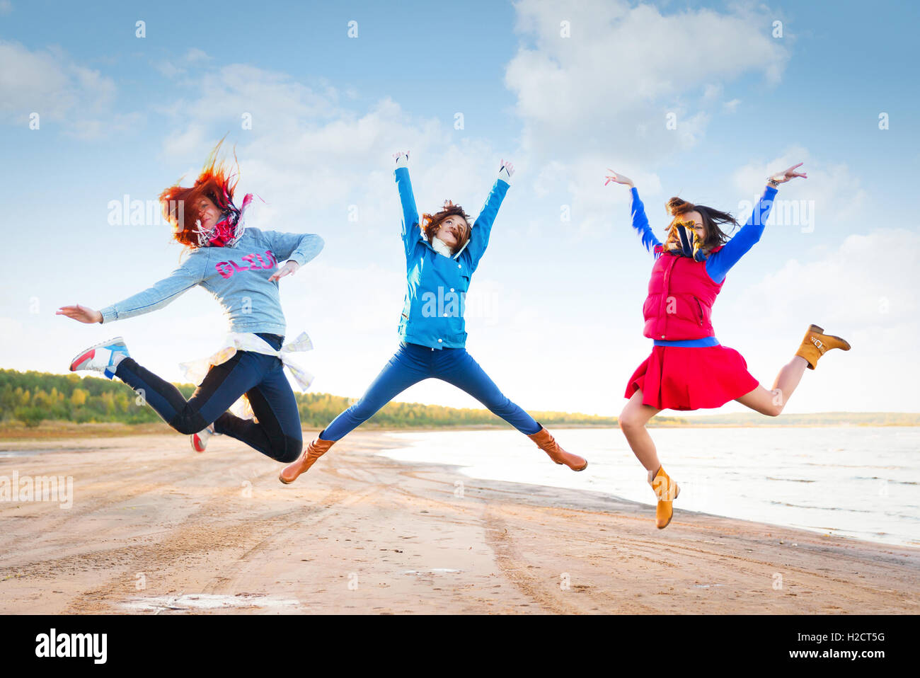 Women have fun near lake Stock Photo - Alamy