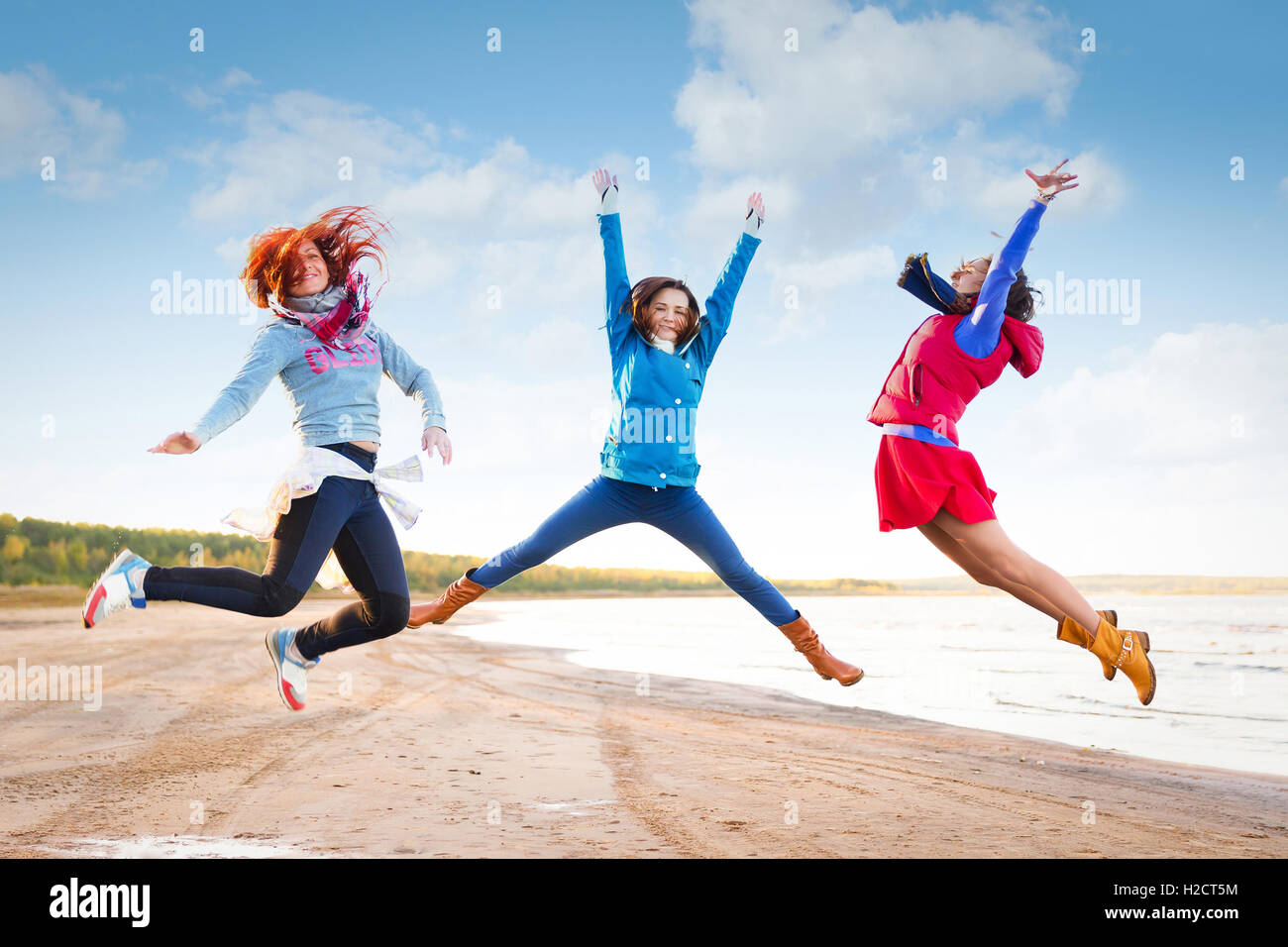 Women have fun near lake Stock Photo - Alamy