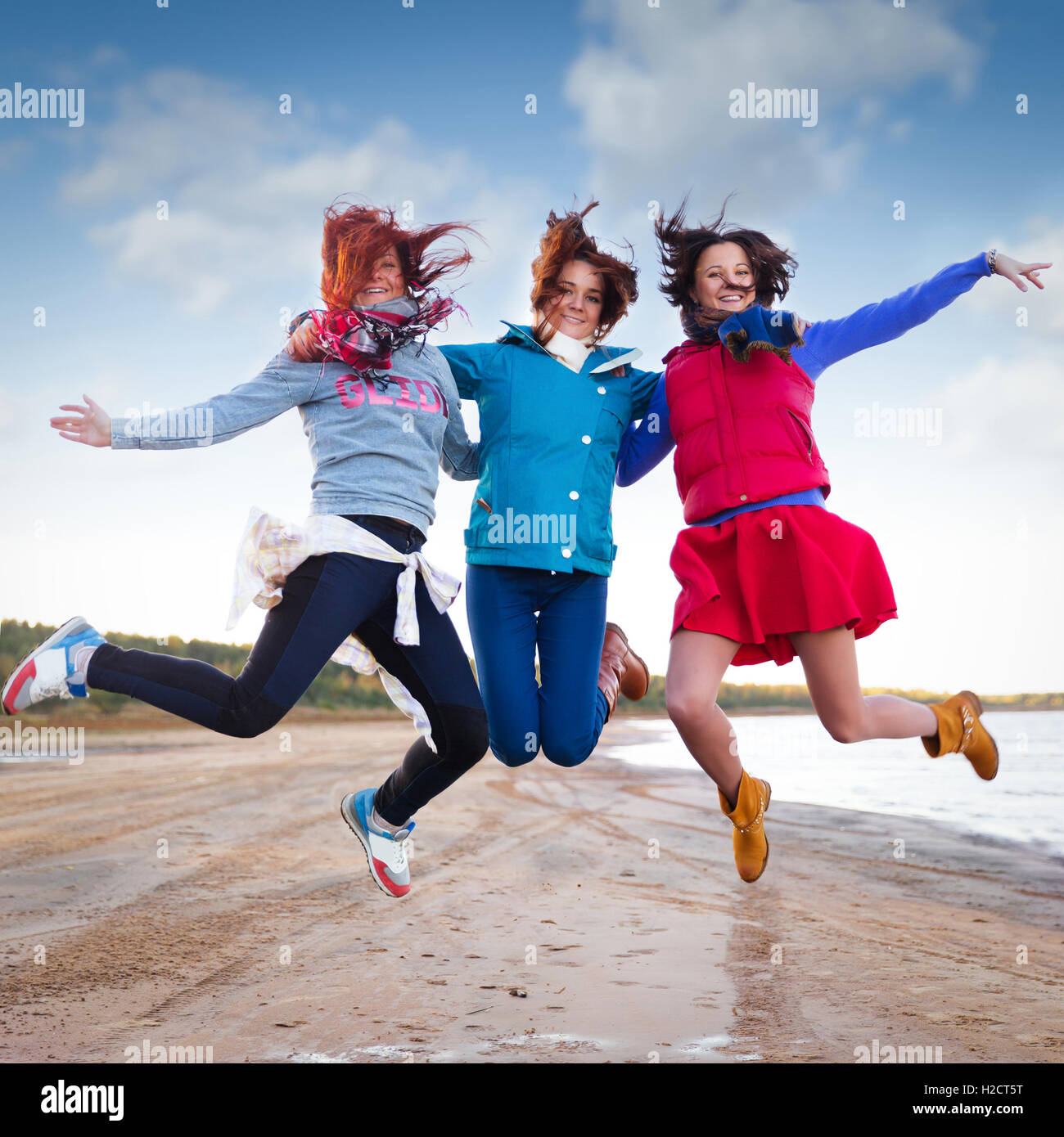 Women have fun near lake Stock Photo - Alamy