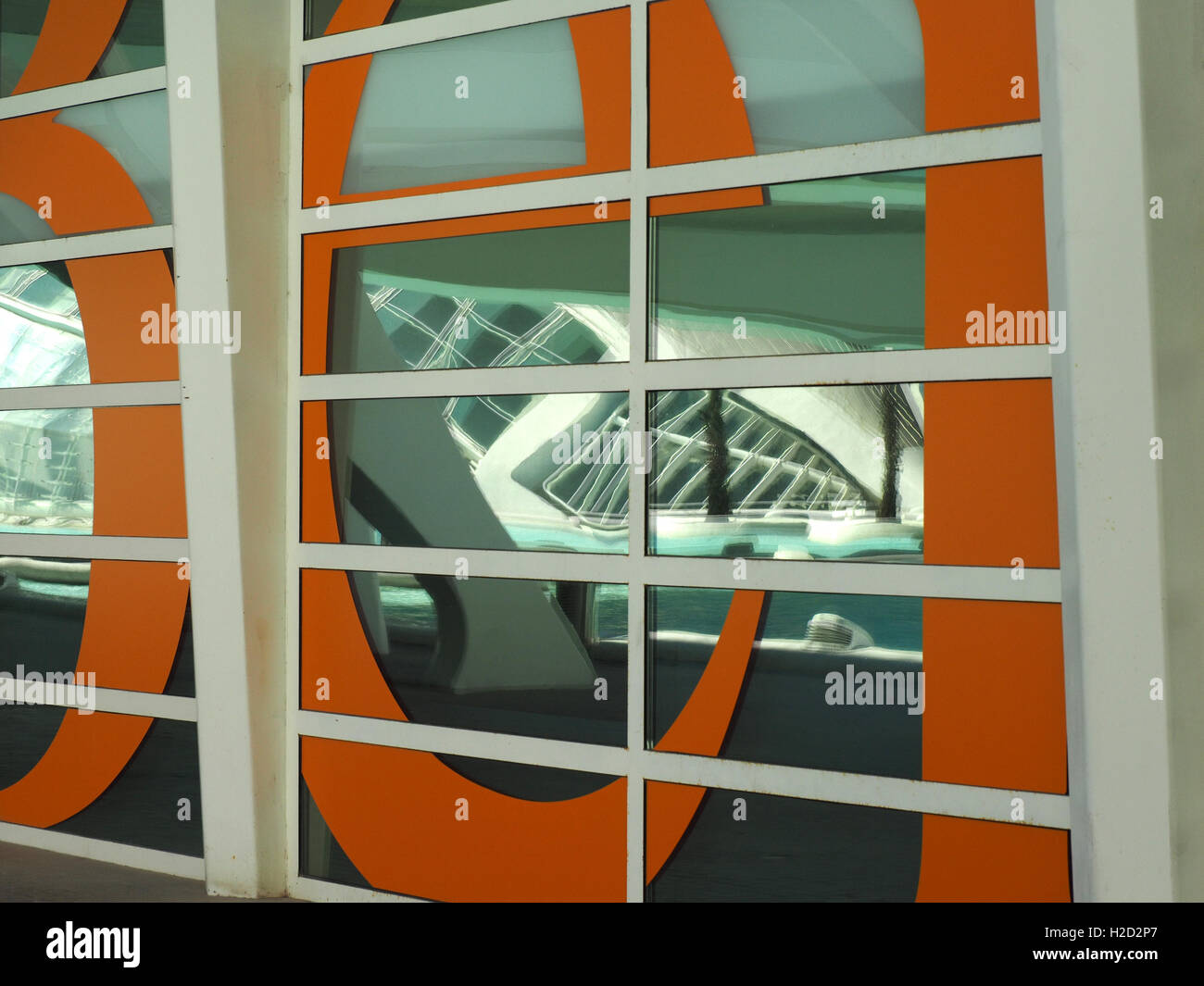 reflections of concrete & glass curves in rectangular orange framed ...
