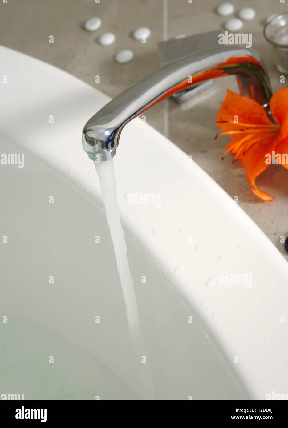 water tap with flowers in spa salon.shallow DOF Stock Photo - Alamy