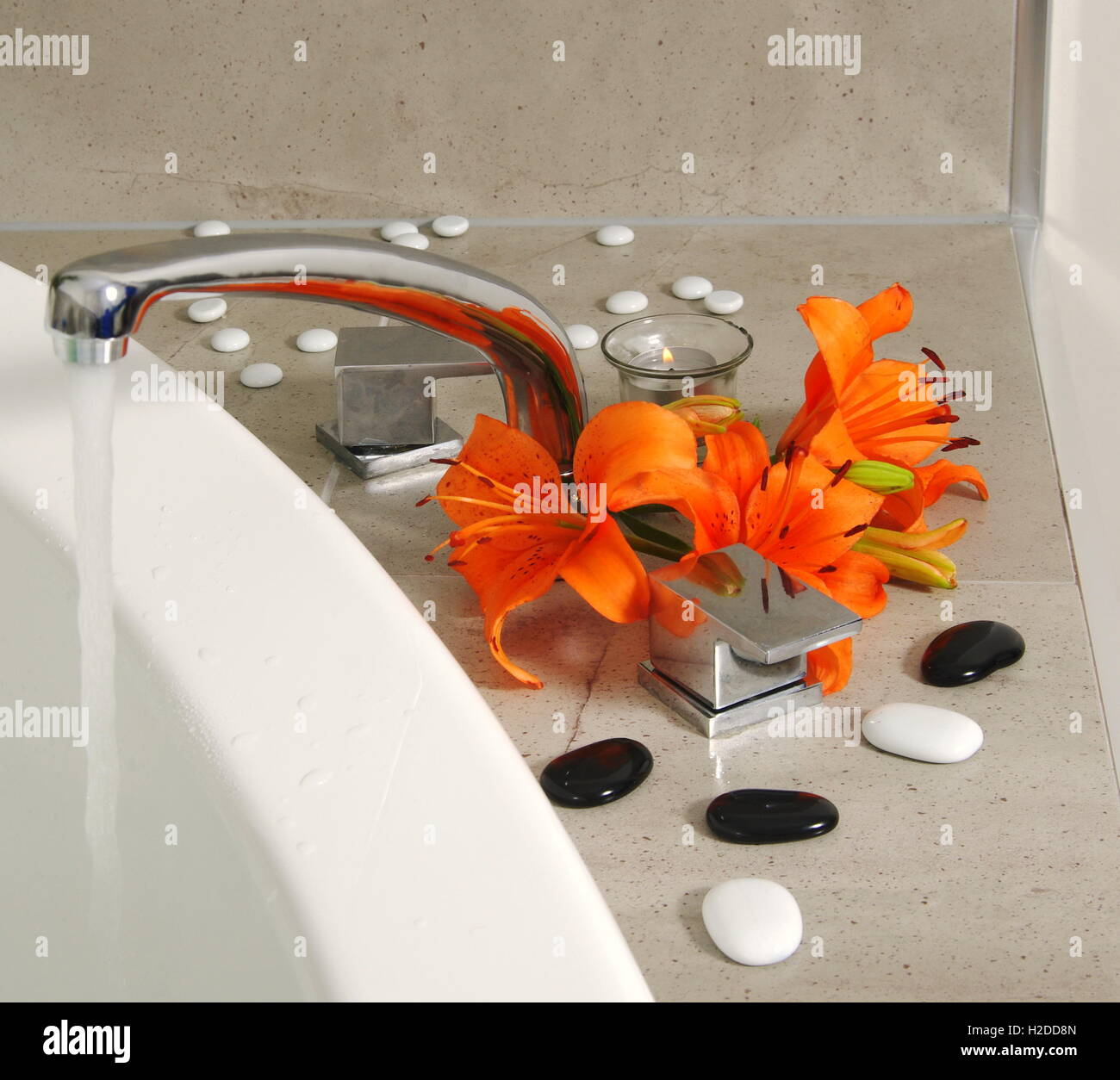 water tap with flowers in spa salon.shallow DOF Stock Photo - Alamy