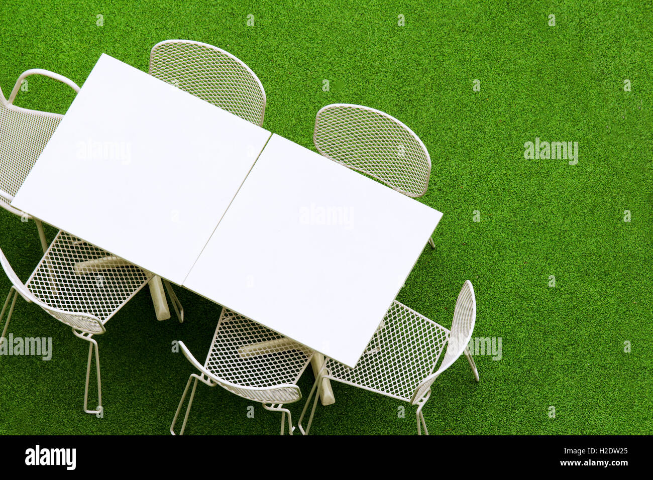 Outdoor chair and table on lawn Stock Photo - Alamy
