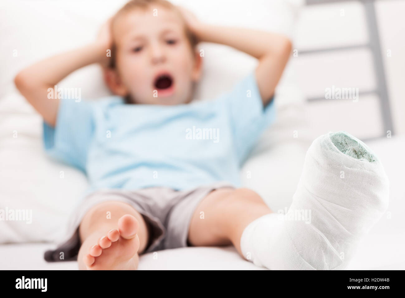 Little child boy with plaster bandage on leg heel fracture or br Stock ...