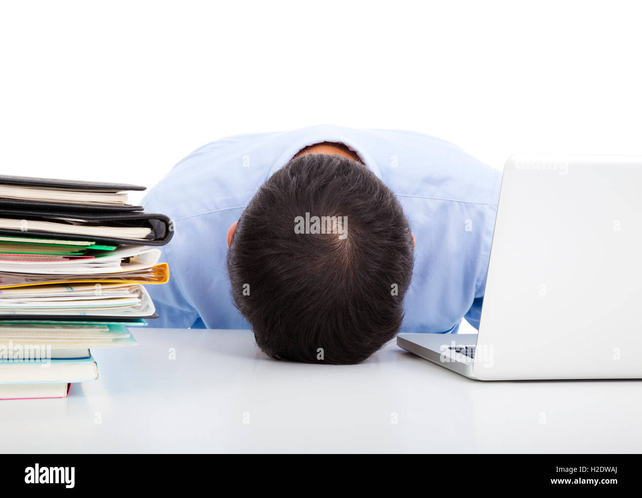 Exhausted businessman falling asleep at his office desk Stock Photo - Alamy