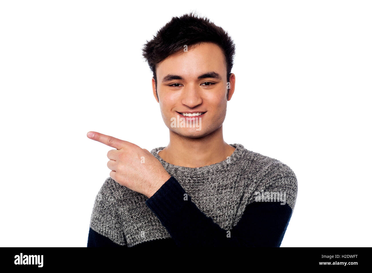 Young man pointing at something Stock Photo - Alamy