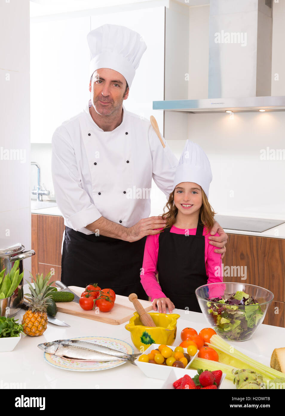 Chef master and junior pupil kid girl at cooking school Stock Photo - Alamy