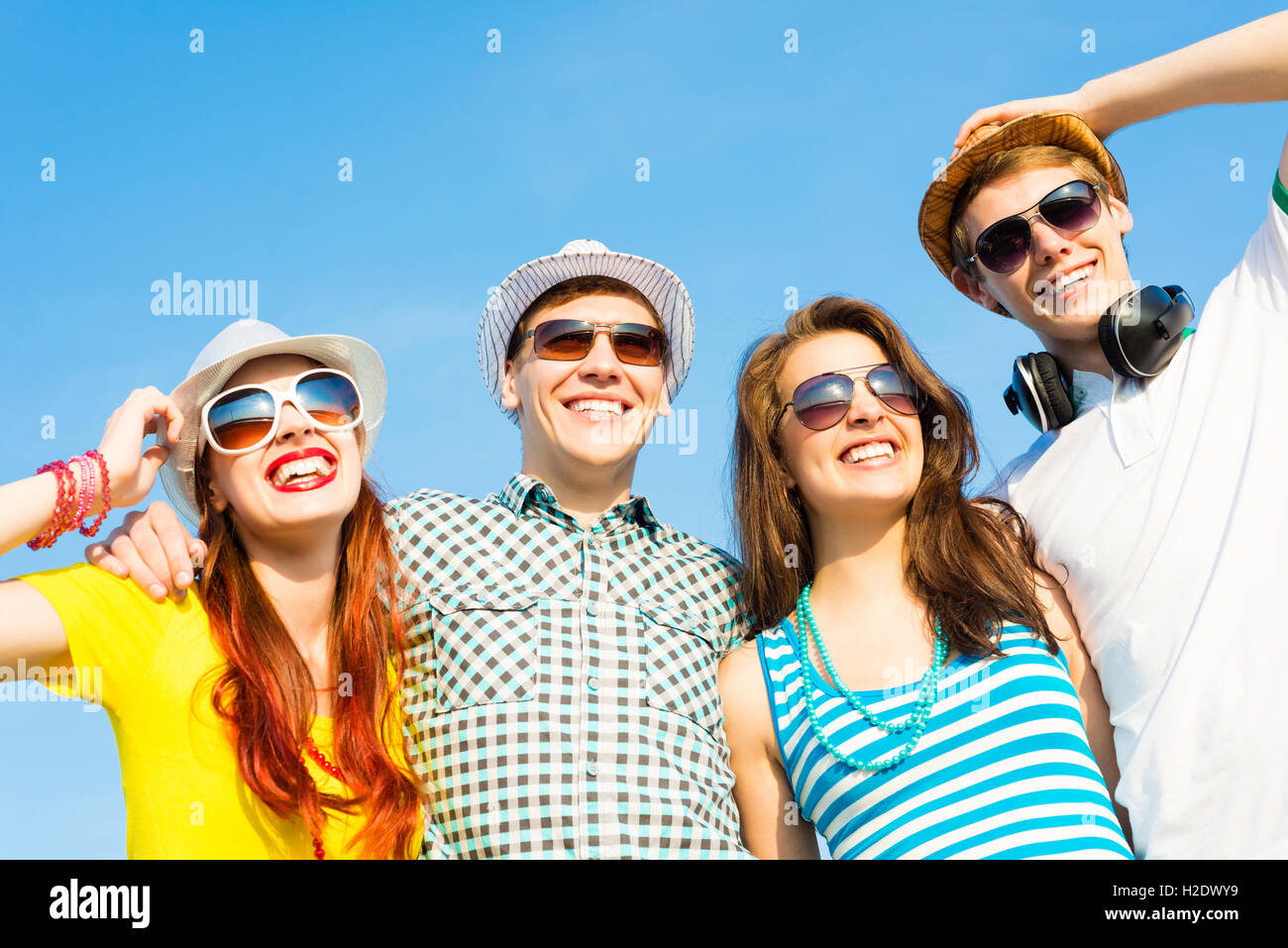 group of young people wearing sunglasses and hat Stock Photo - Alamy