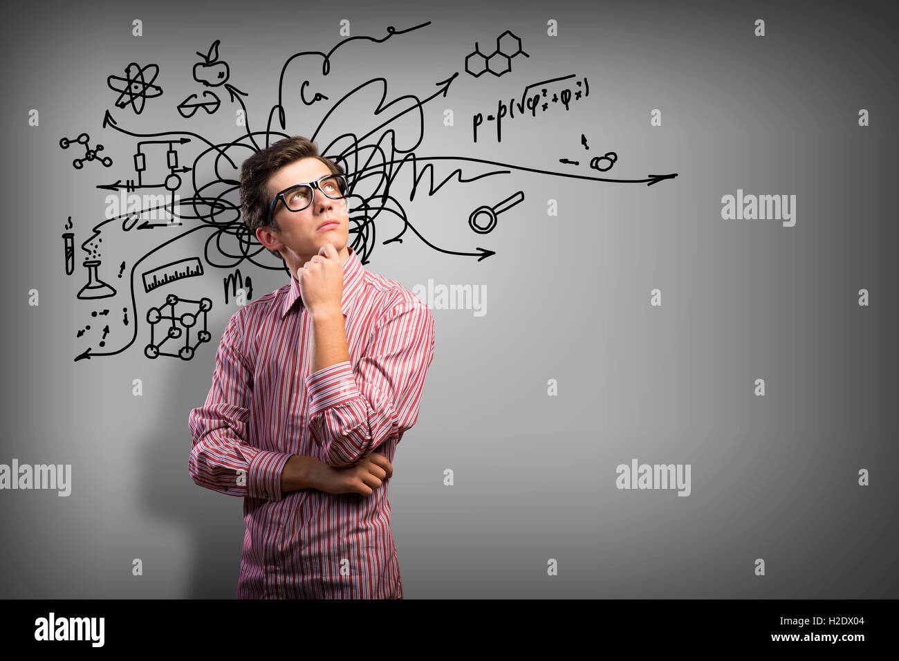 young man scientist with glasses thinking Stock Photo - Alamy