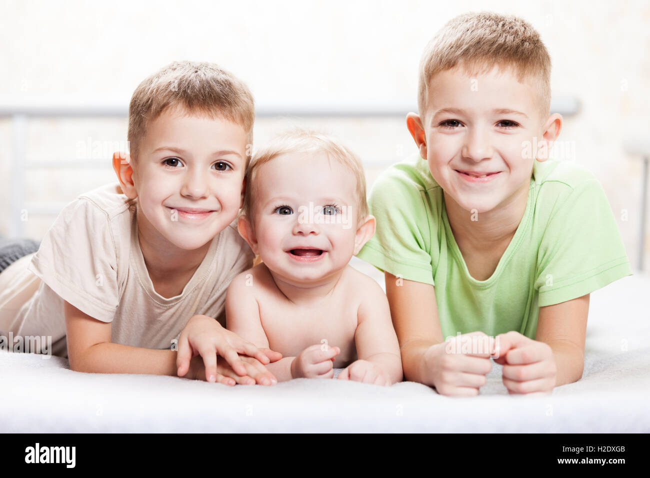 Three brother boys Stock Photo - Alamy