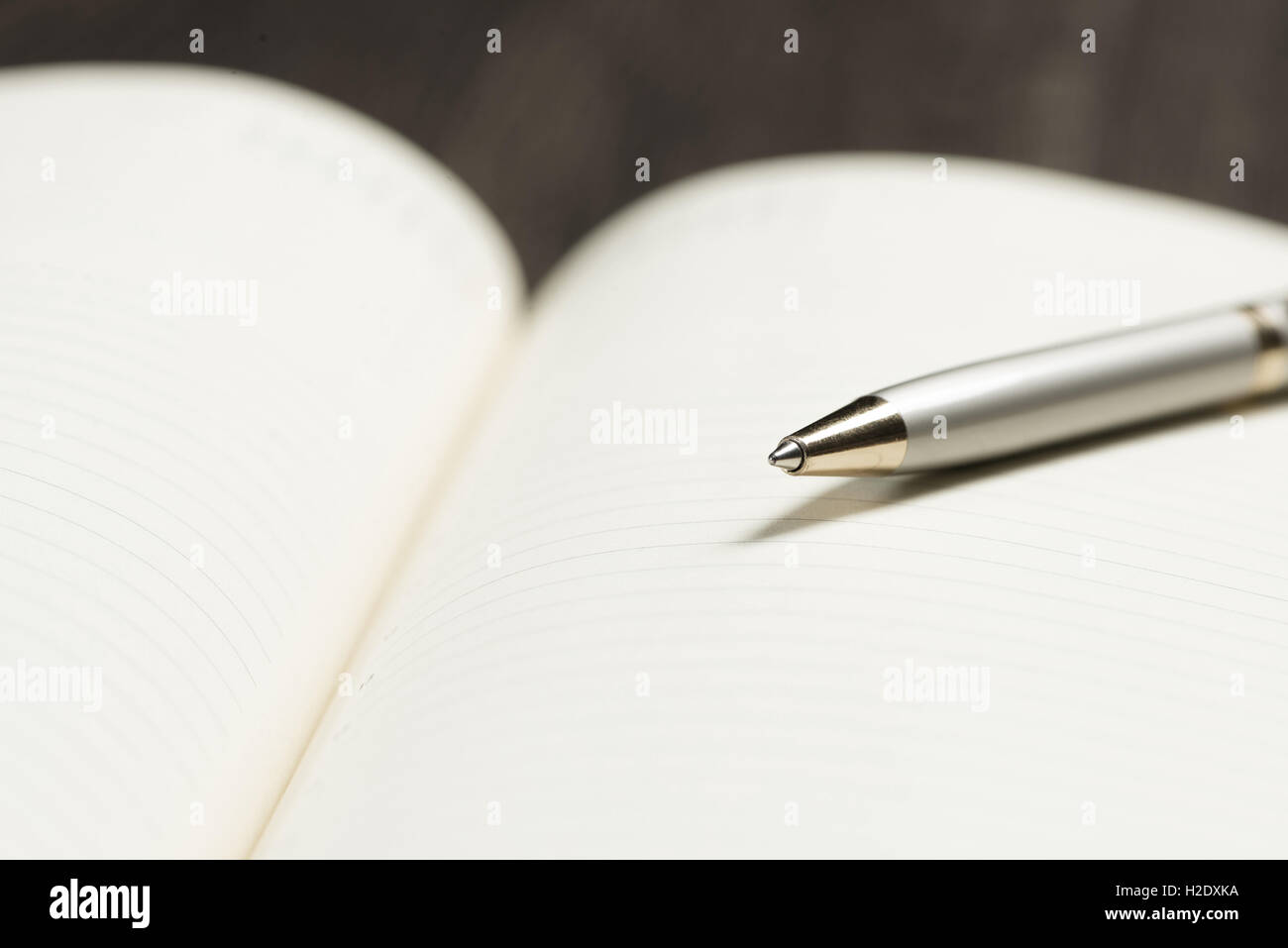 pen and open notepad Stock Photo - Alamy