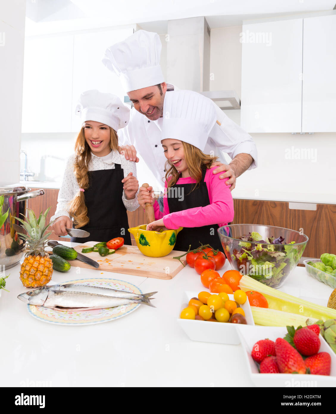 Chef master and junior pupil kid girls at cooking school Stock Photo ...
