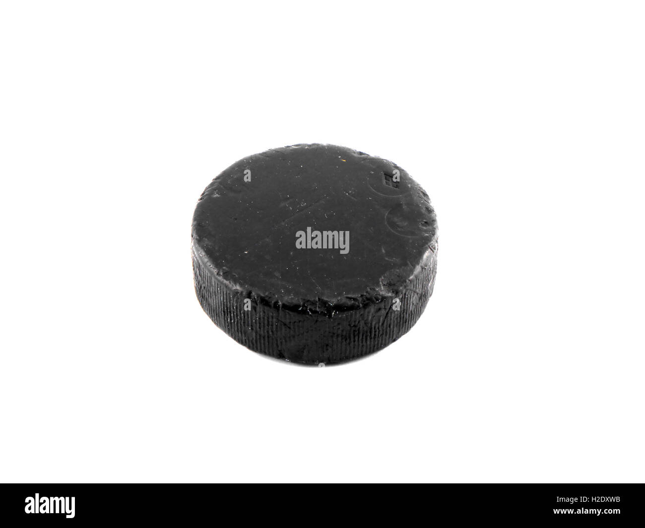 Hockey puck isolated on white background Stock Photo - Alamy