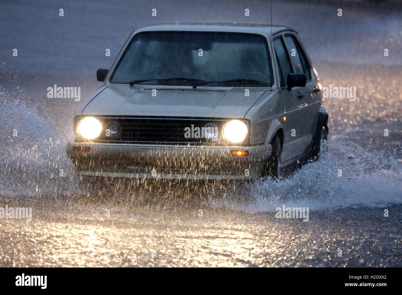 Vehicle Driving in Heavy Rain Stock Photo - Alamy