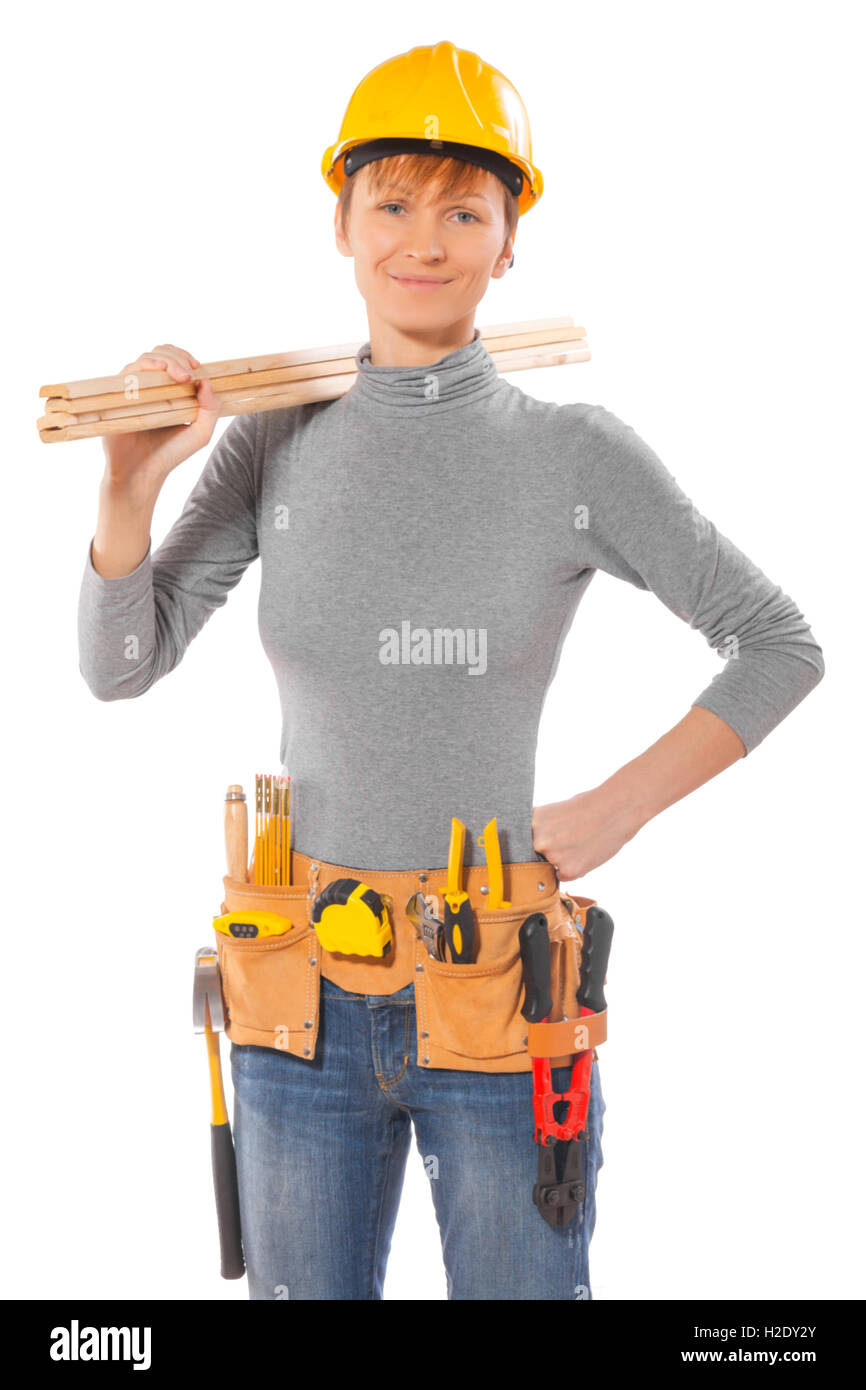 female worker wearing working clothes holding wooden planks Stock Photo ...