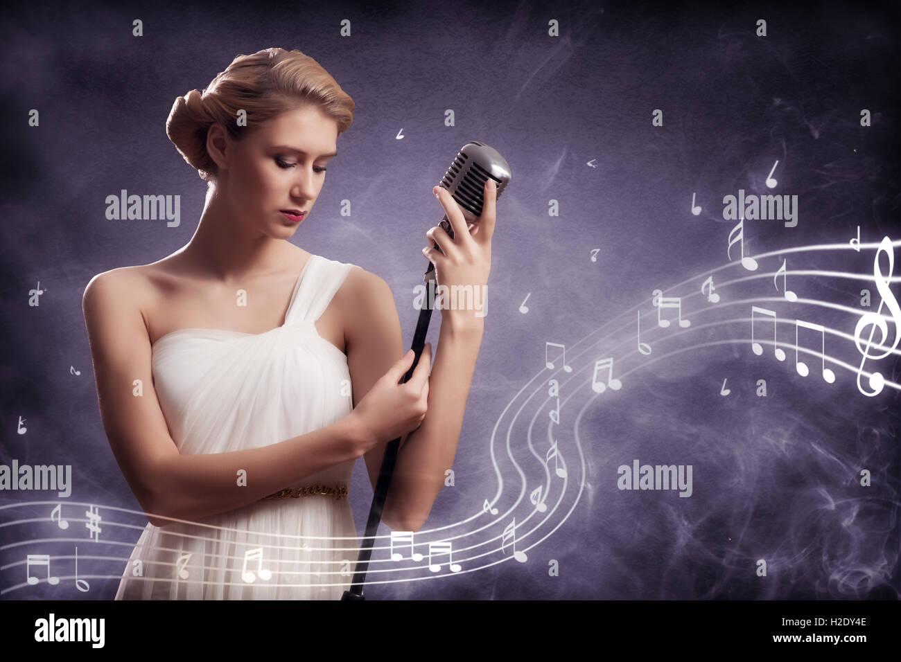 attractive female singer with microphone Stock Photo - Alamy