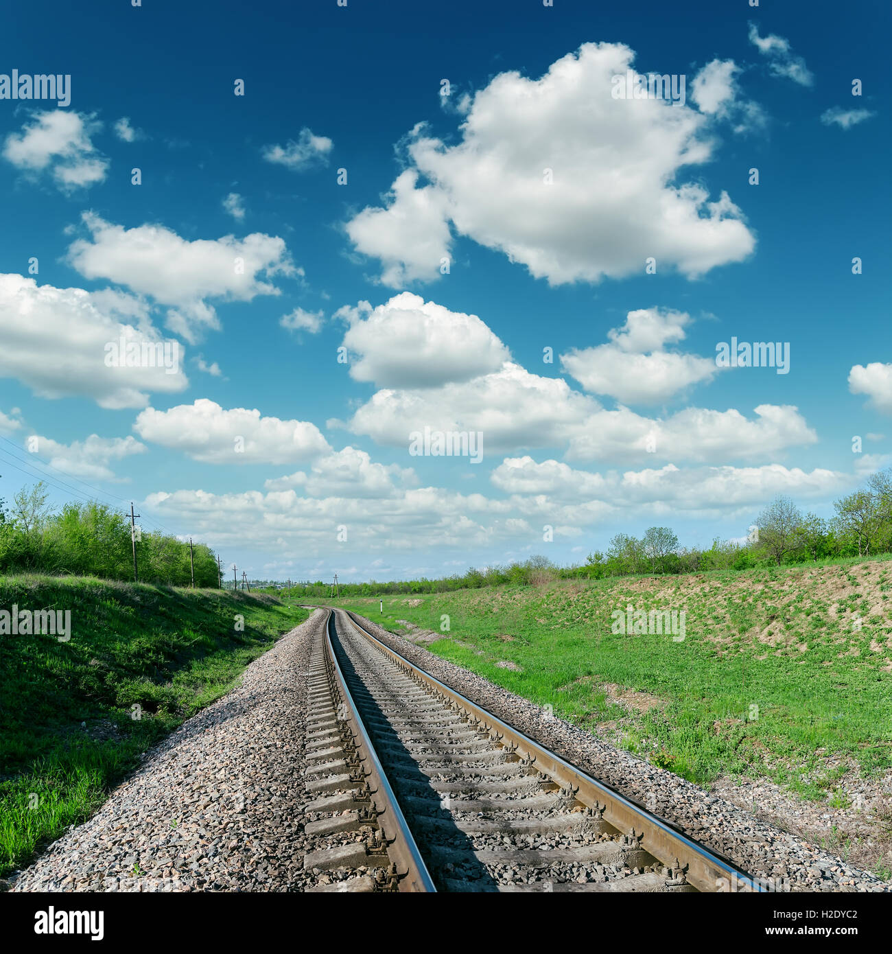 cloudy sky over railroad Stock Photo - Alamy