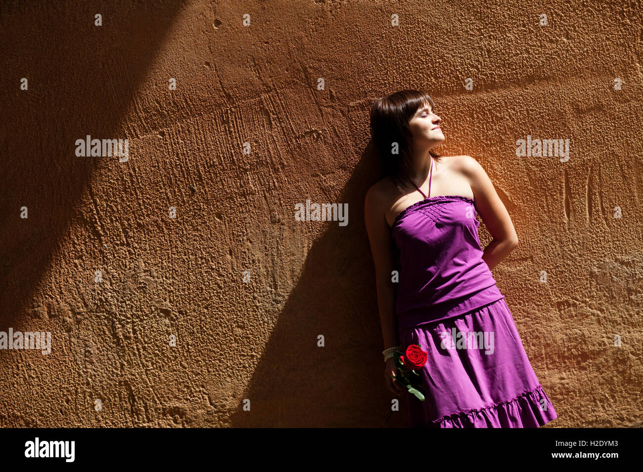 girl by the wall Stock Photo - Alamy