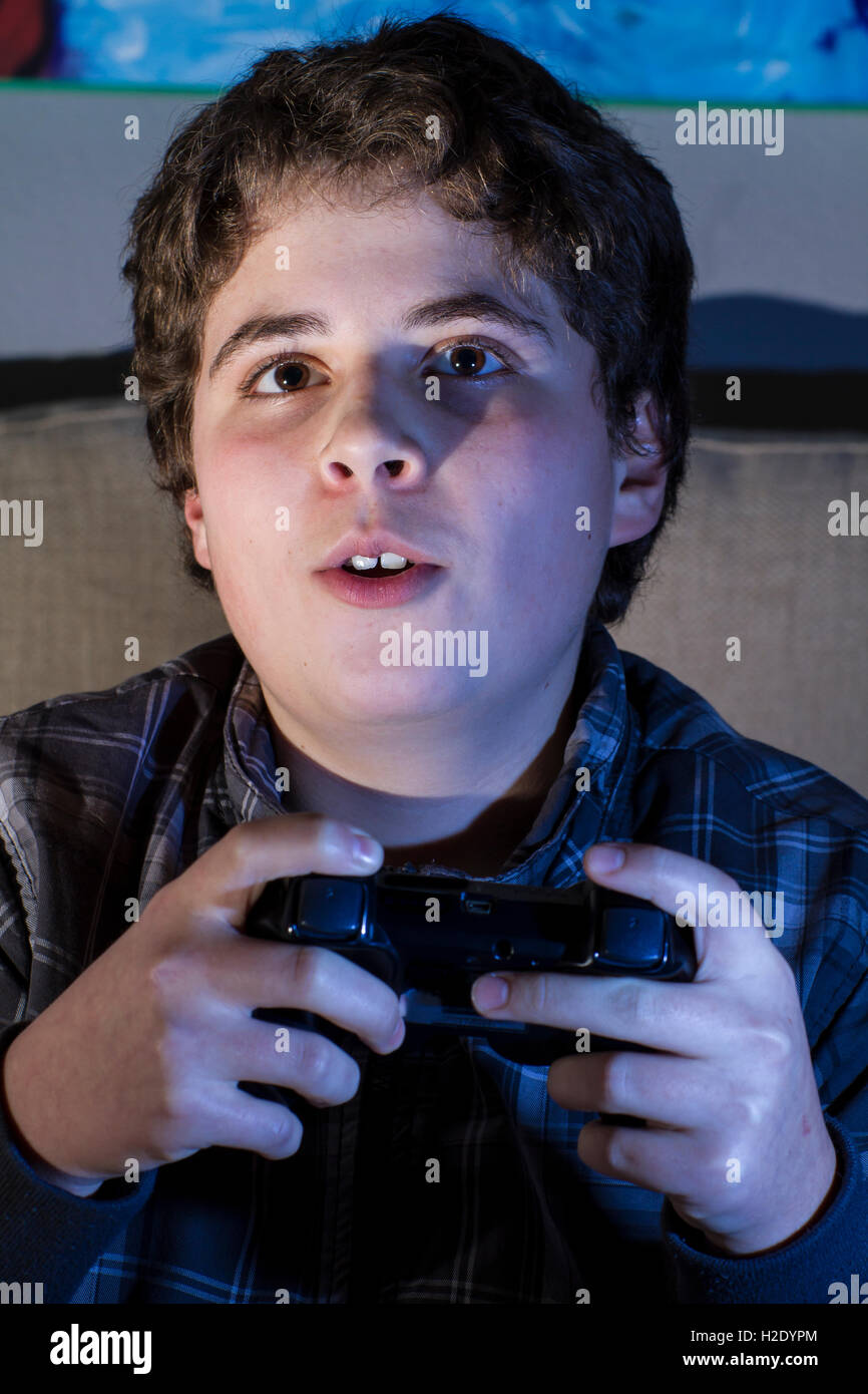 Technology. boy with joystick playing computer game at home Stock Photo ...