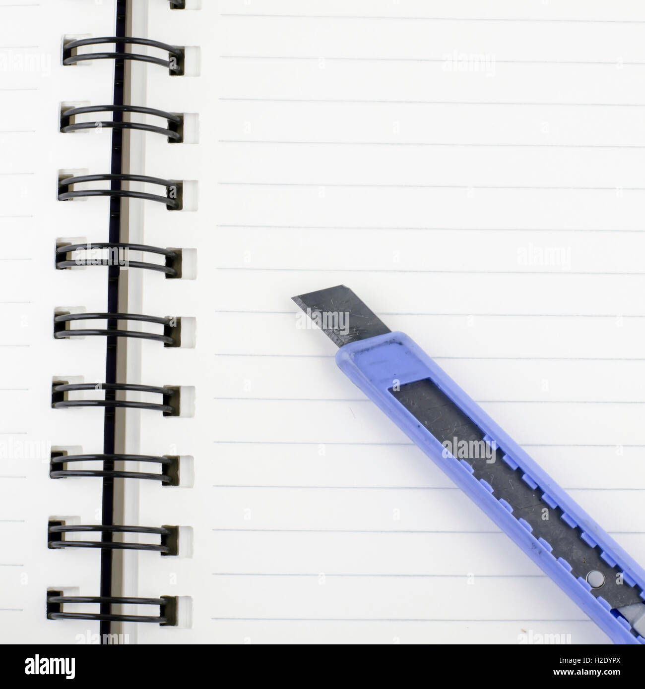 cutter on notebook Stock Photo - Alamy